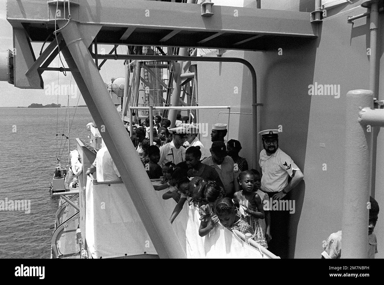 Crewmen of the guided missile destroyer USS DEWEY (DDG-45) welcome a ...