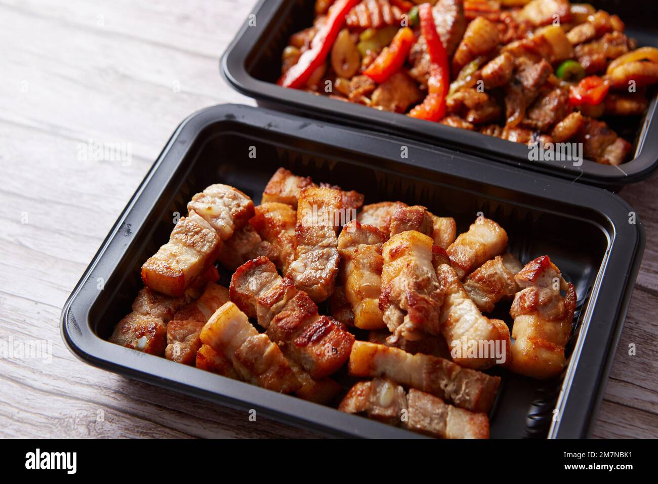 Stir-fried Pork and Spicy Pork in Containers Stock Photo - Alamy