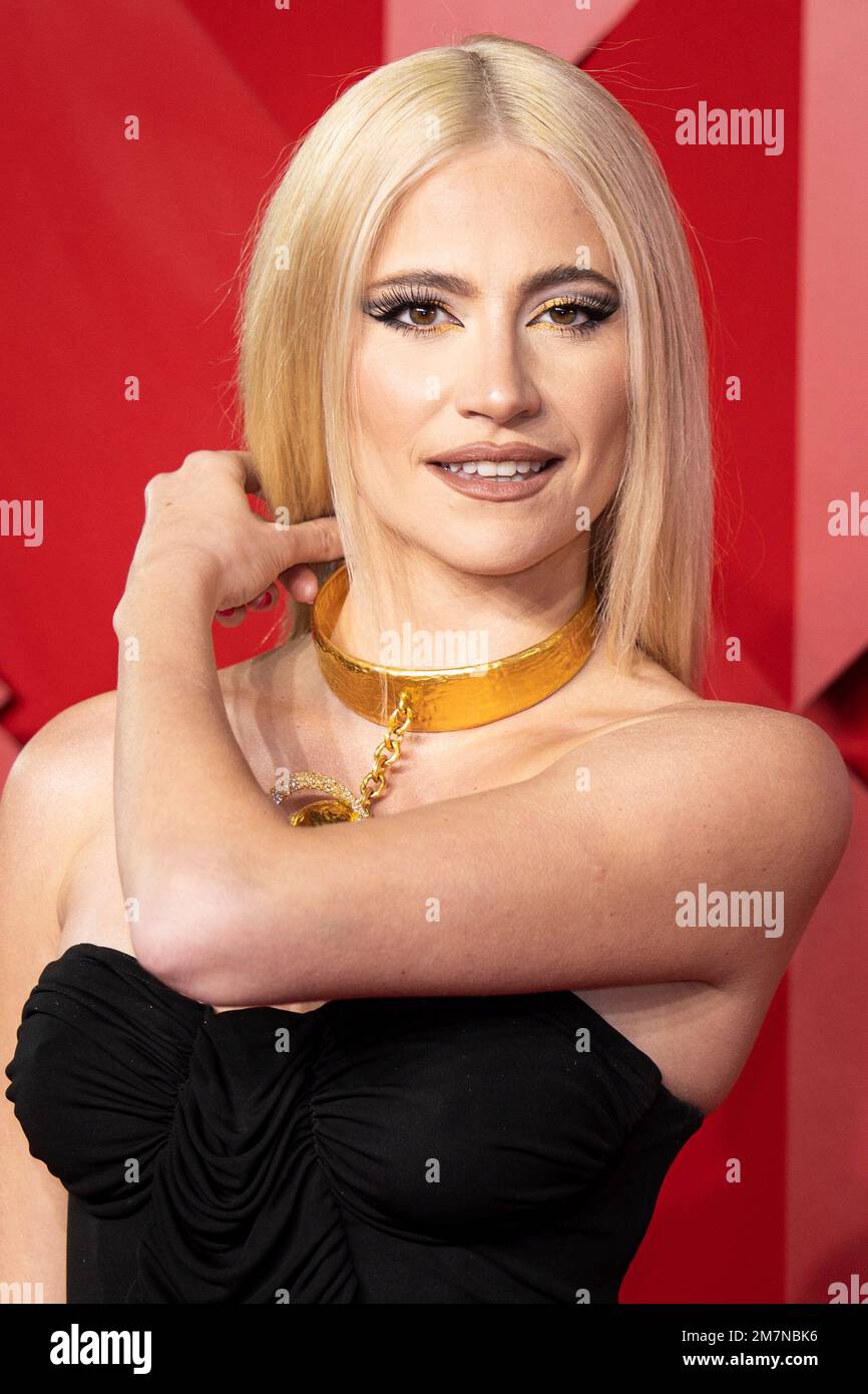 Pixie Lott poses for photographers upon arrival at the British Fashion Awards in London, Monday ...