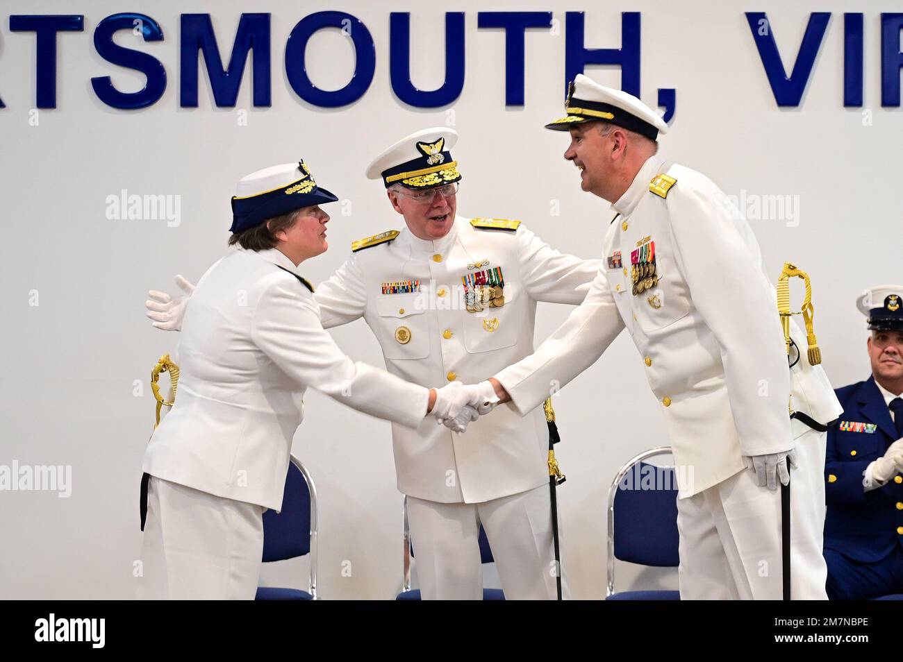 Rear Adm. Laura Dickey, outgoing 5th District commander, shakes hands ...