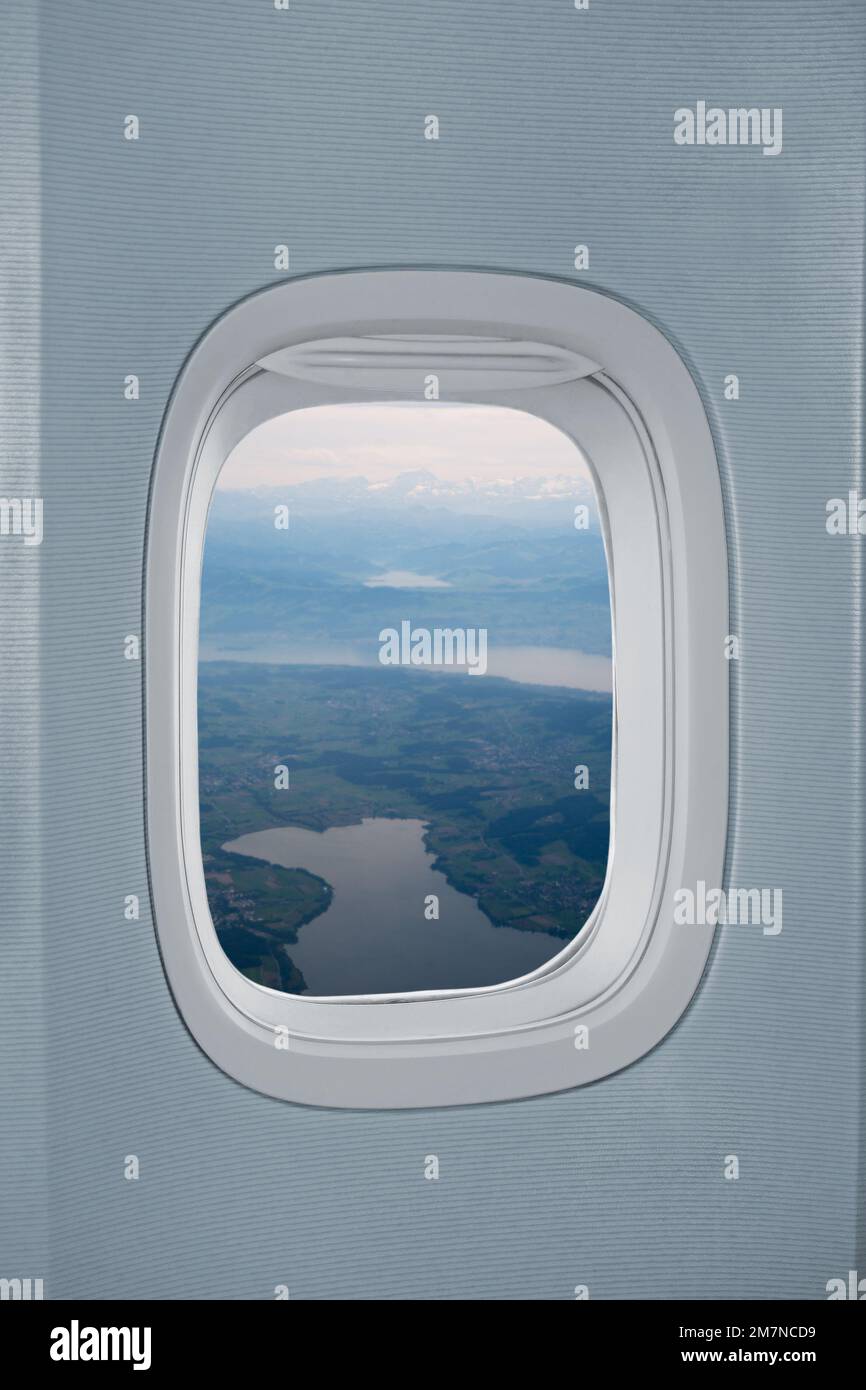 Airplane window with landscape Stock Photo - Alamy