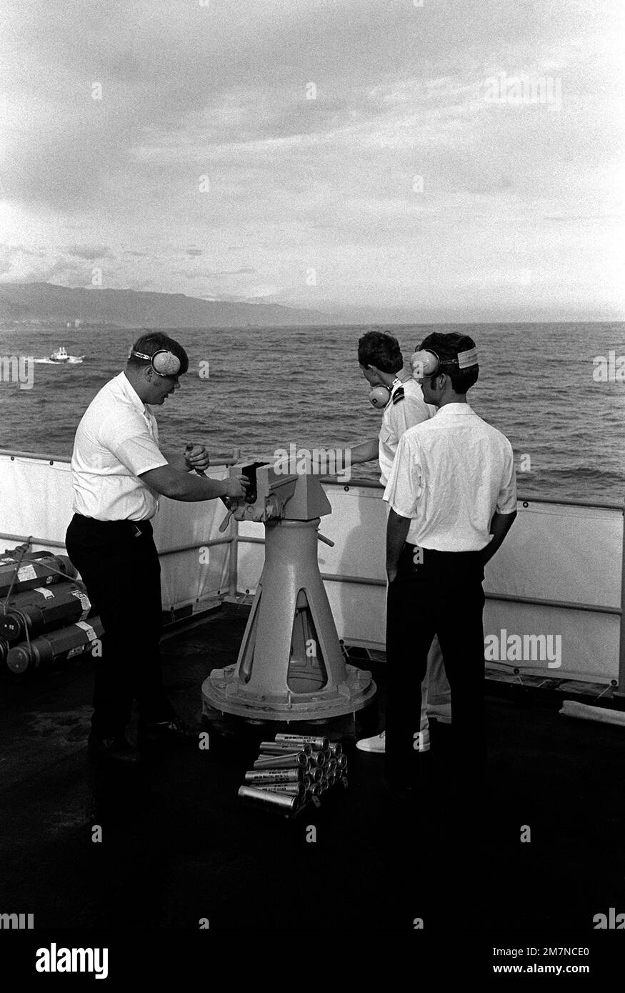 Crewmen on board the guided missile destroyer USS DEWEY (DDG-45) load ...