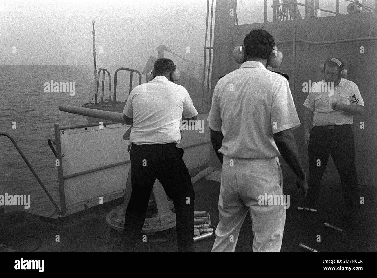 Crewmen aboard the guided missile destroyer USS DEWEY (DDG-45) begin ...