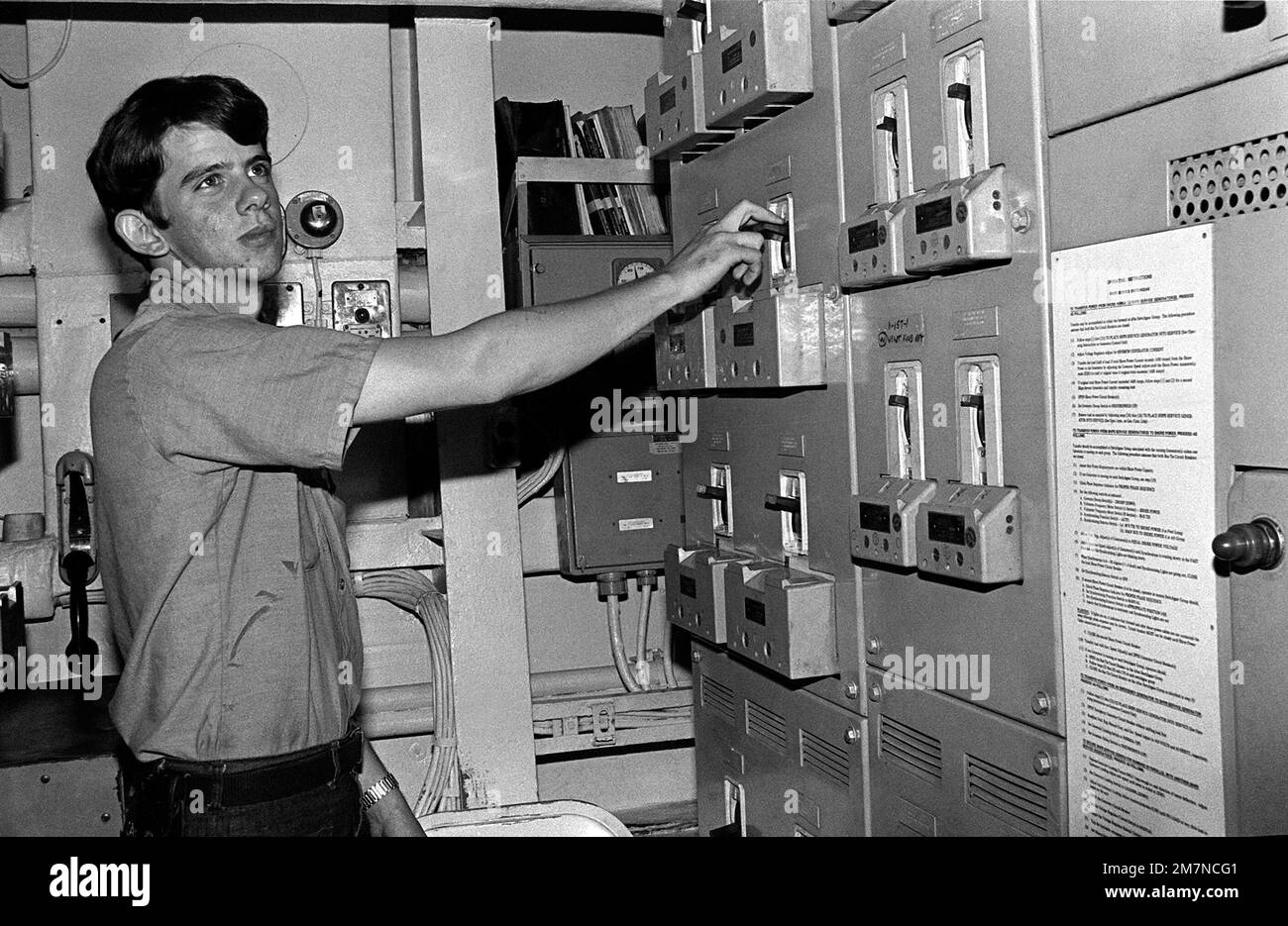 An electrician's mate aboard the guided missile destroyer USS DEWEY ...