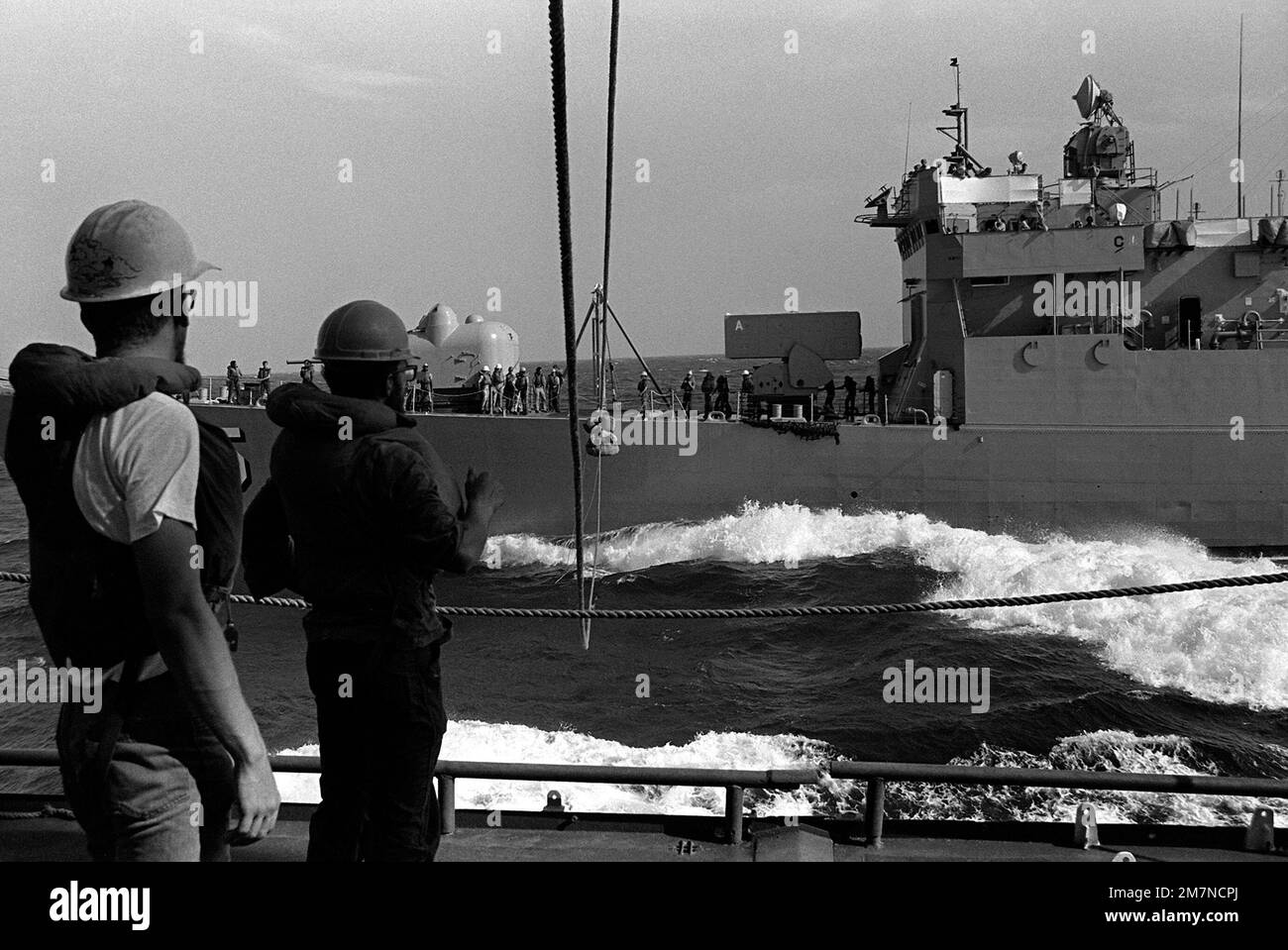 Crewmen aboard the guided missile destroyer USS DEWEY (DDG-45 ...