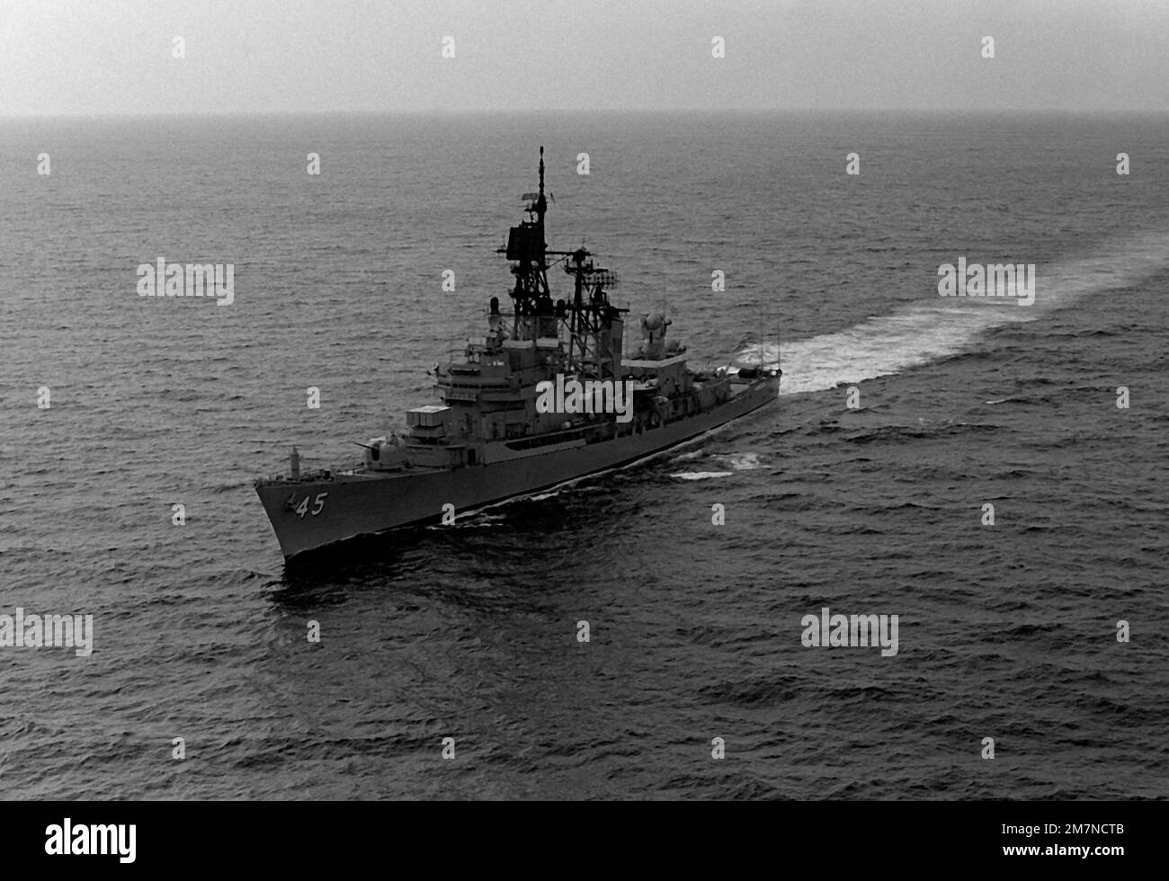 An aerial port bow view of the guided missile destroyer USS DEWEY (DDG ...