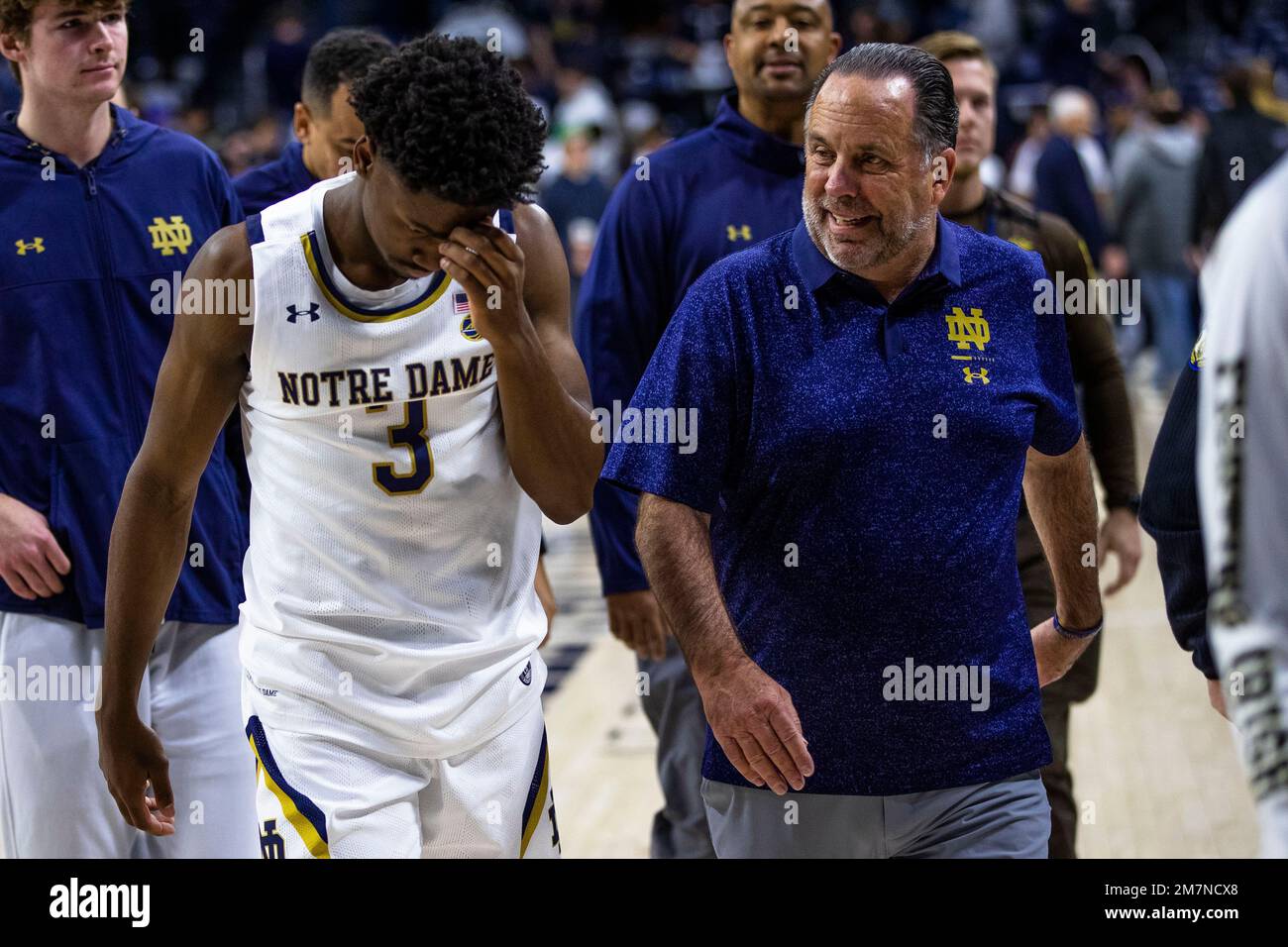 Notre Dame's Trey Wertz (3) and Notre Dame head coach Mike Brey walk ...