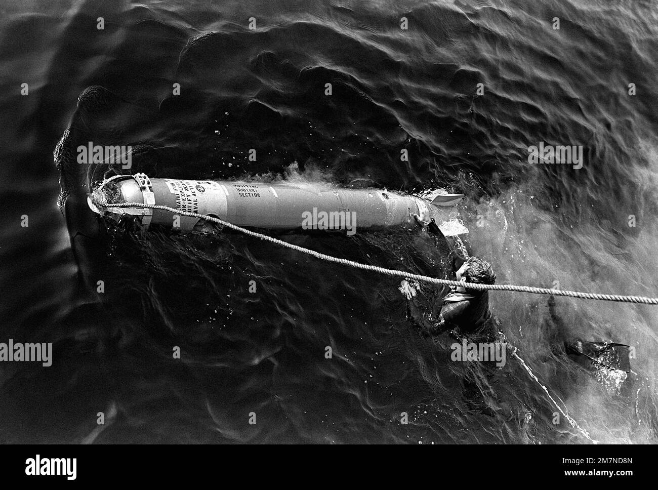 One of the six 12.75-inch torpedoes from the guided missile destroyer ...