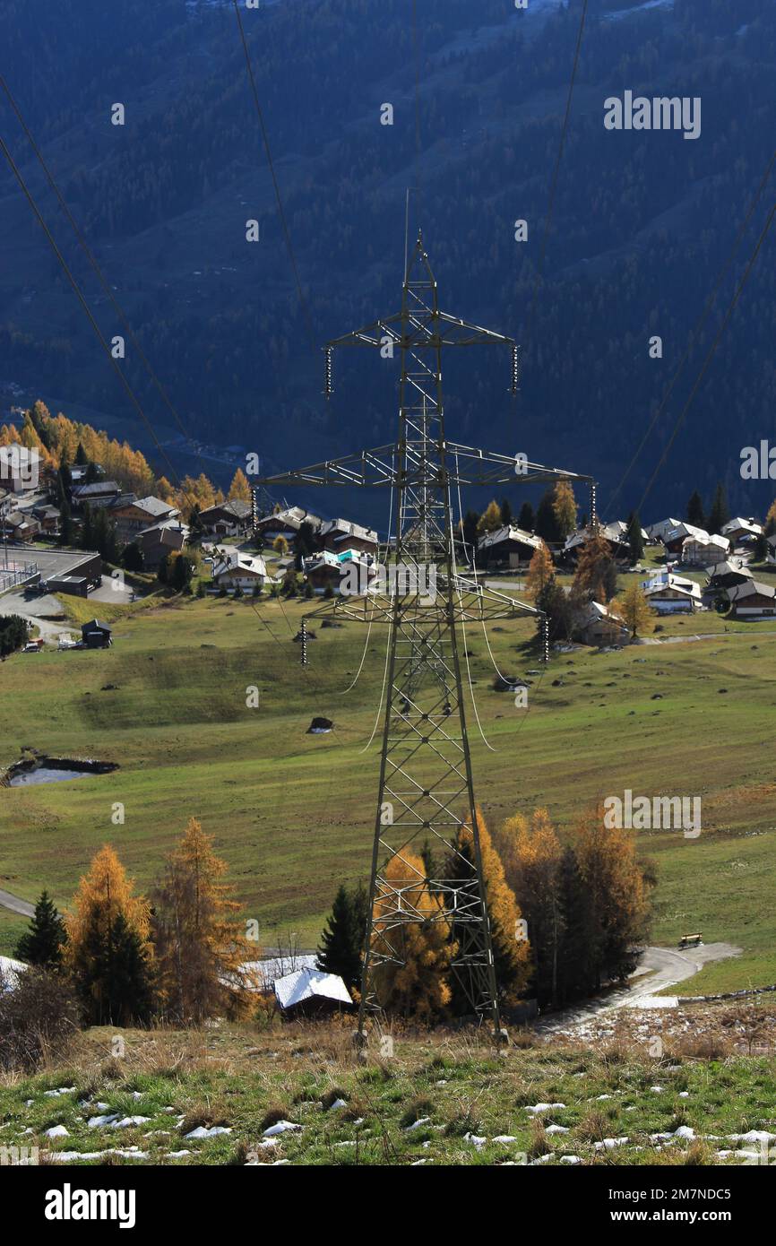 power lines pylon in the Swiss alps in autumn Stock Photo - Alamy