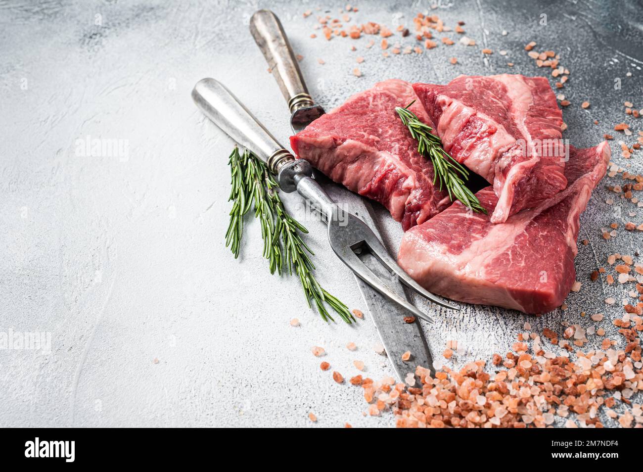 Silverside sirloin beef cut, raw meat on butcher table with herbs ...