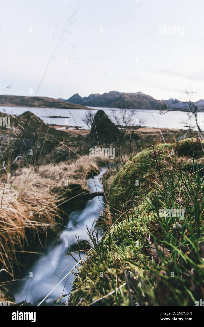 Stream to the sea, fjord landscape in autumn in Vesteralen, Norway ...