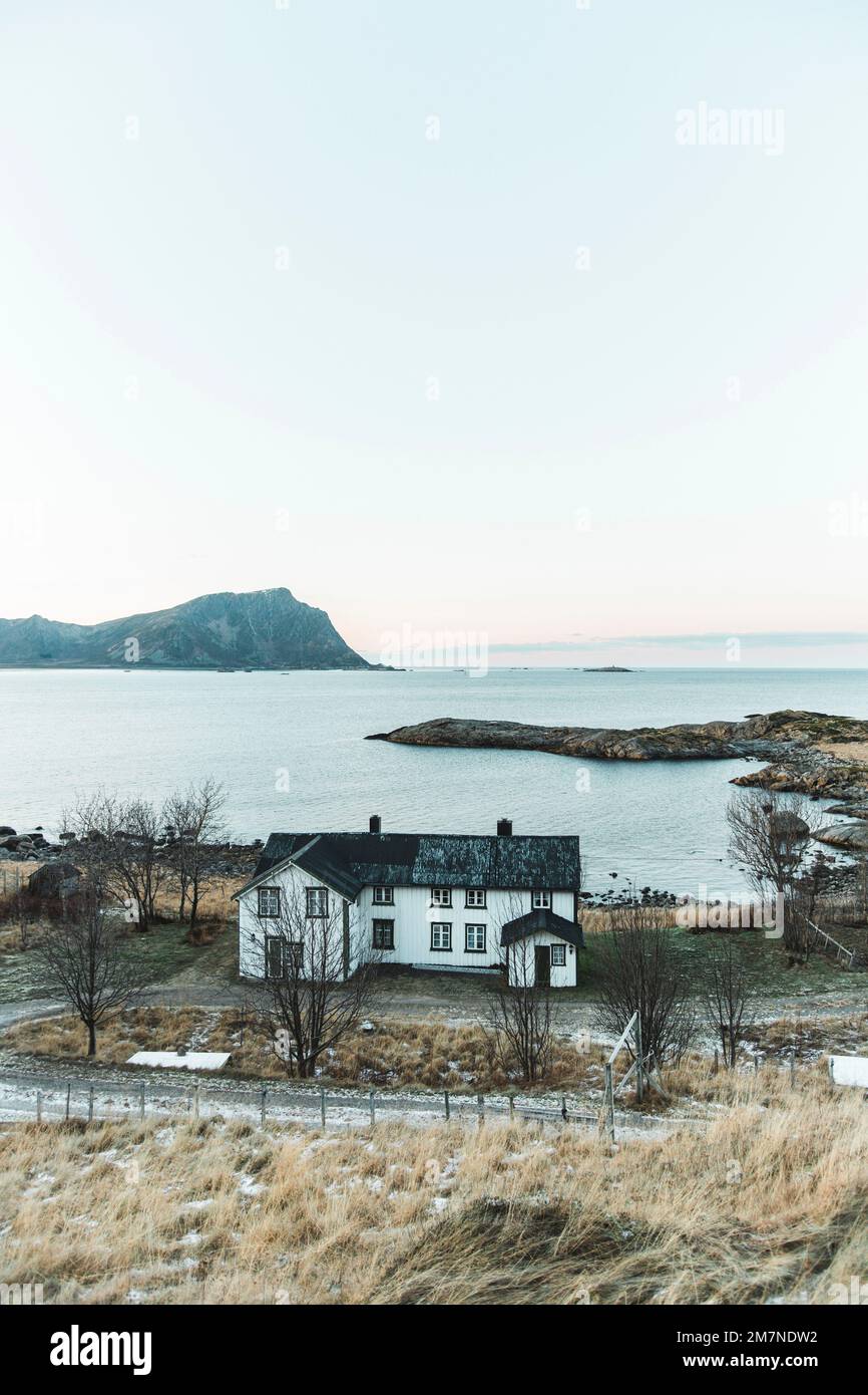Remote dwelling house on estate during evening atmosphere, fjord ...