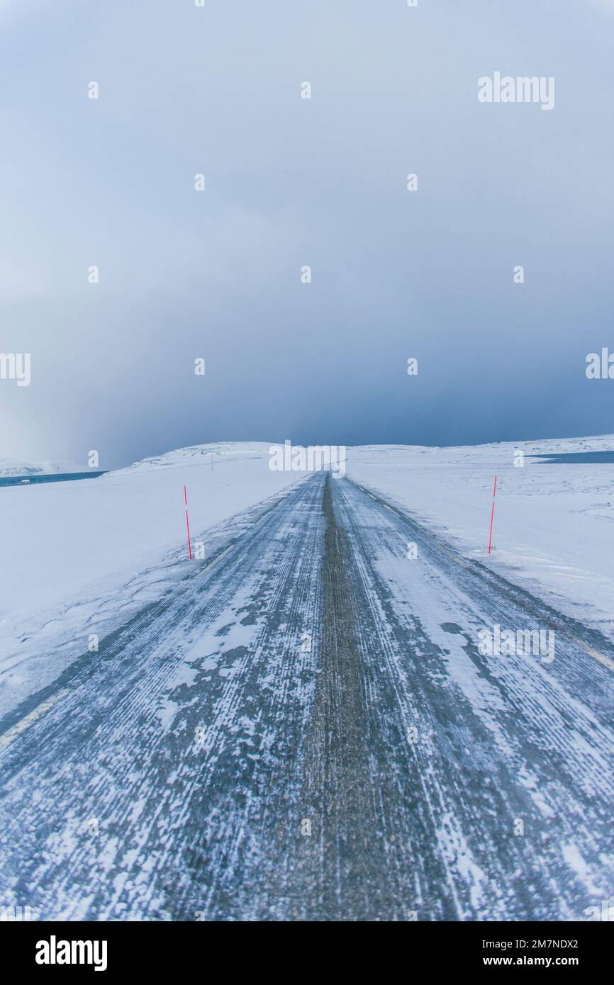 Winter icy road in northern Norway, near Magerøya, snow covered road ...