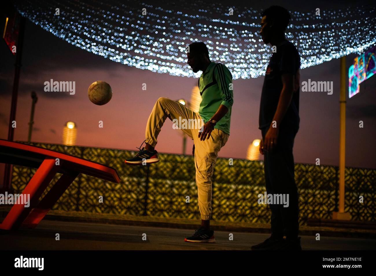 Men play a ball at the Corniche sea promenade in Doha, Qatar, Wednesday ...