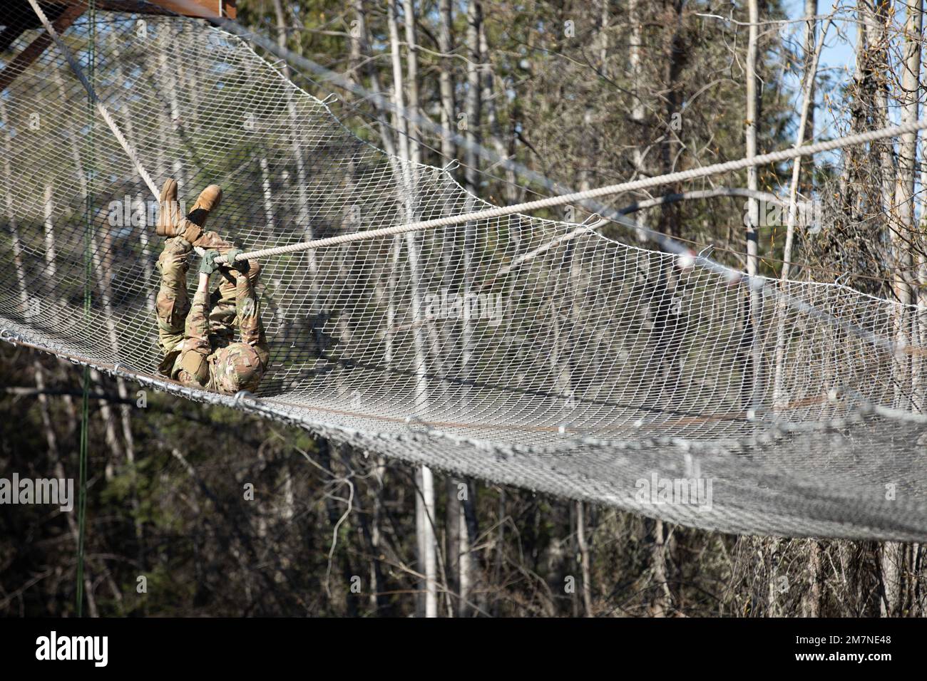 A Soldier crosses a Slide-for-Life obstacle during the Best Warrior ...