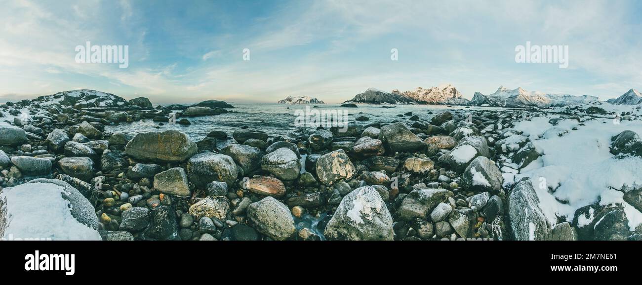 Snowy winter landscape on the rocky coast in Norway, panoramic image of ...