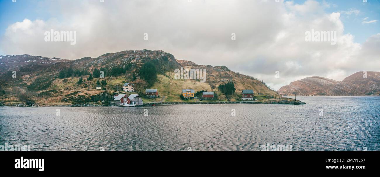 Panoramic picture of lonely fishermen huts on fjord in Norway, typical ...
