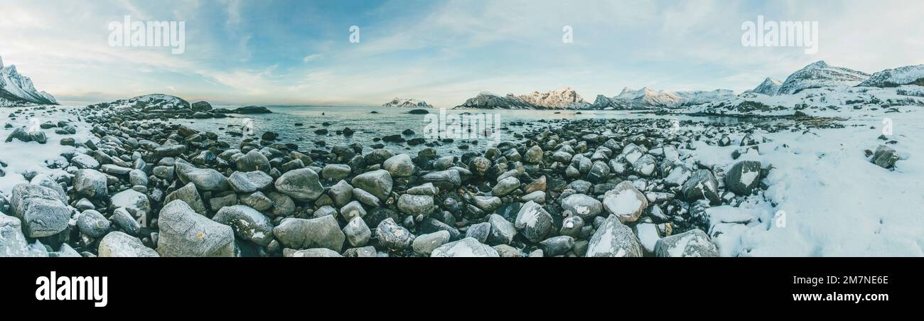 Snowy winter landscape on the rocky coast in Norway, panoramic image of ...