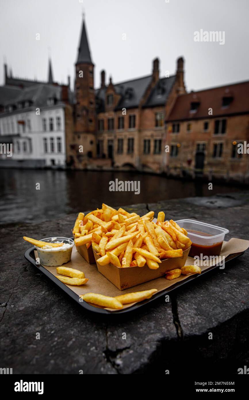 French fries on the background of the canal in Bruges, Belgium Stock ...