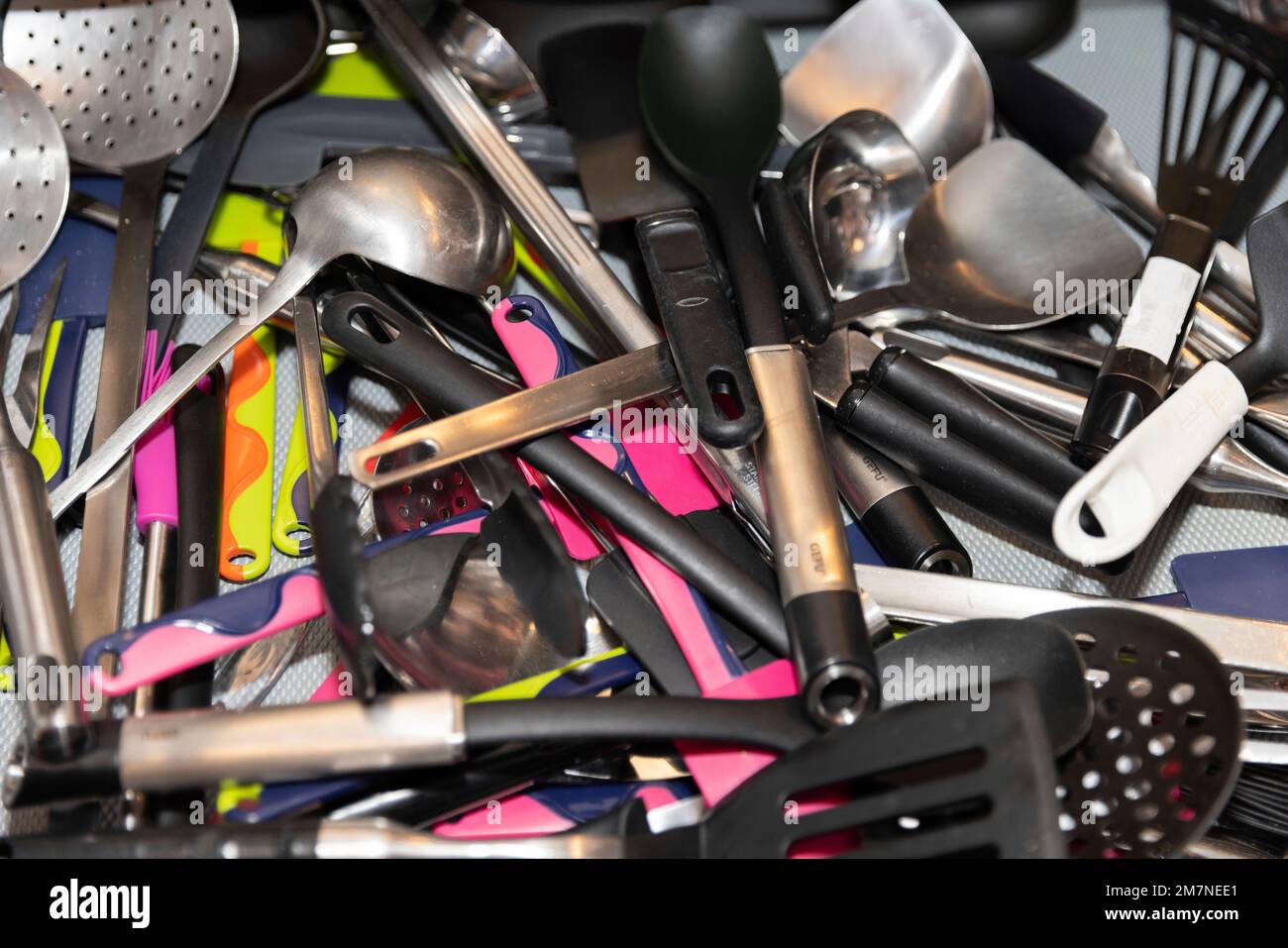 Messy pile of cooking utensils Stock Photo - Alamy