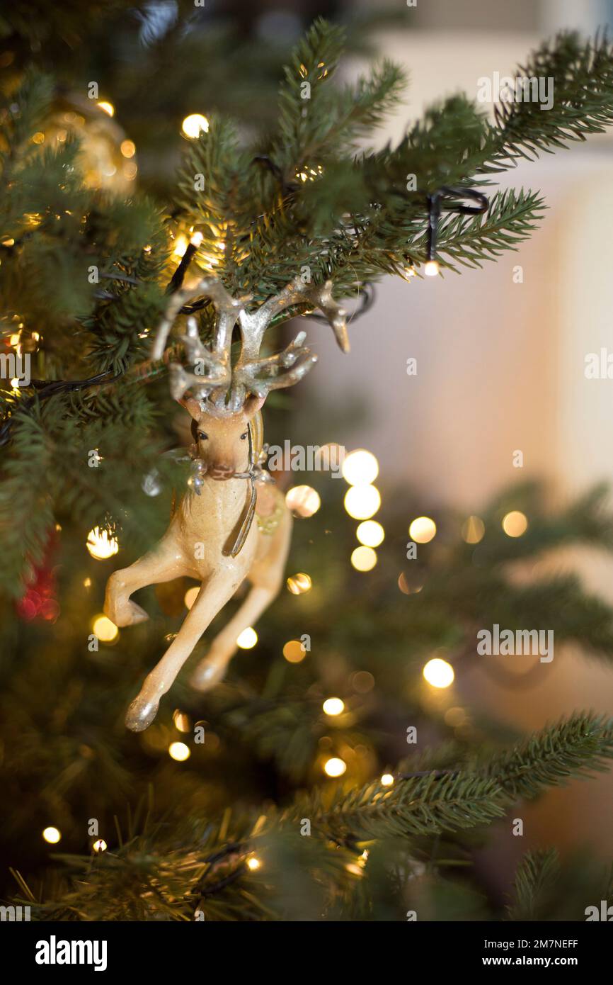 Christmas tree figurine in the shape of reindeer in lighted Christmas ...