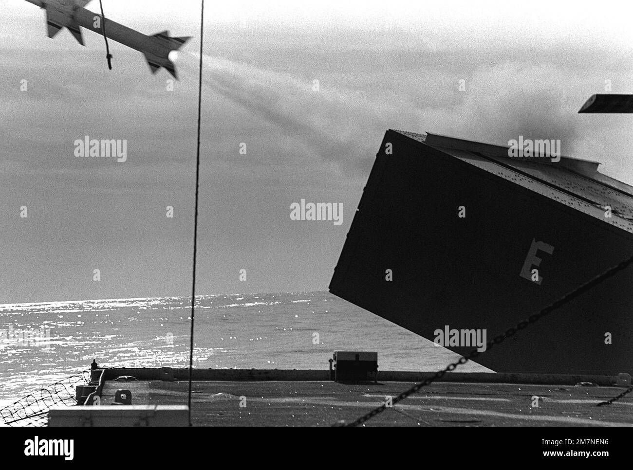 A Sea Sparrow missile is launched from the eight-tube base point ...