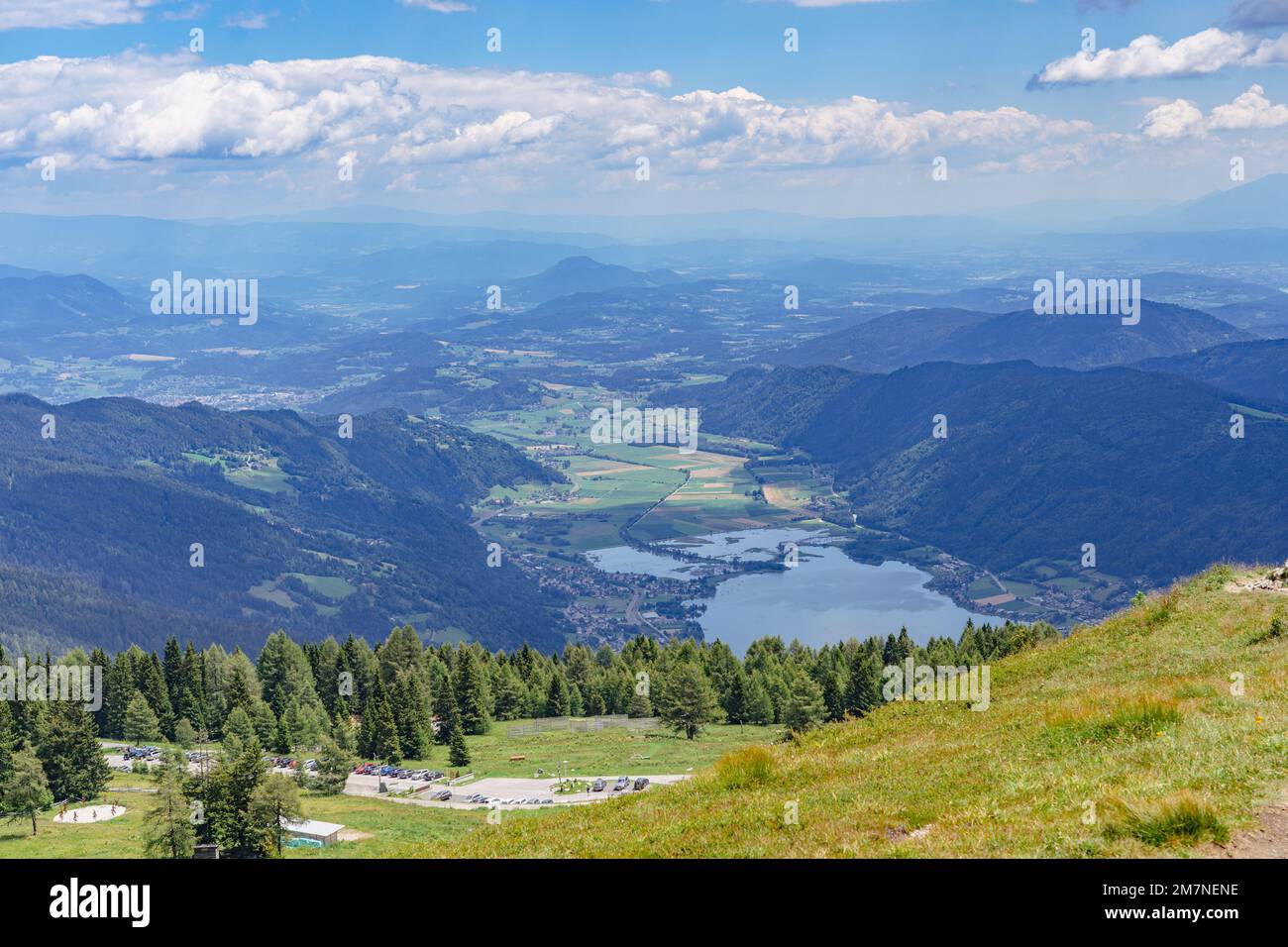 The big mountains of the Gerlitzen Alps in Austria and a lake with the ...