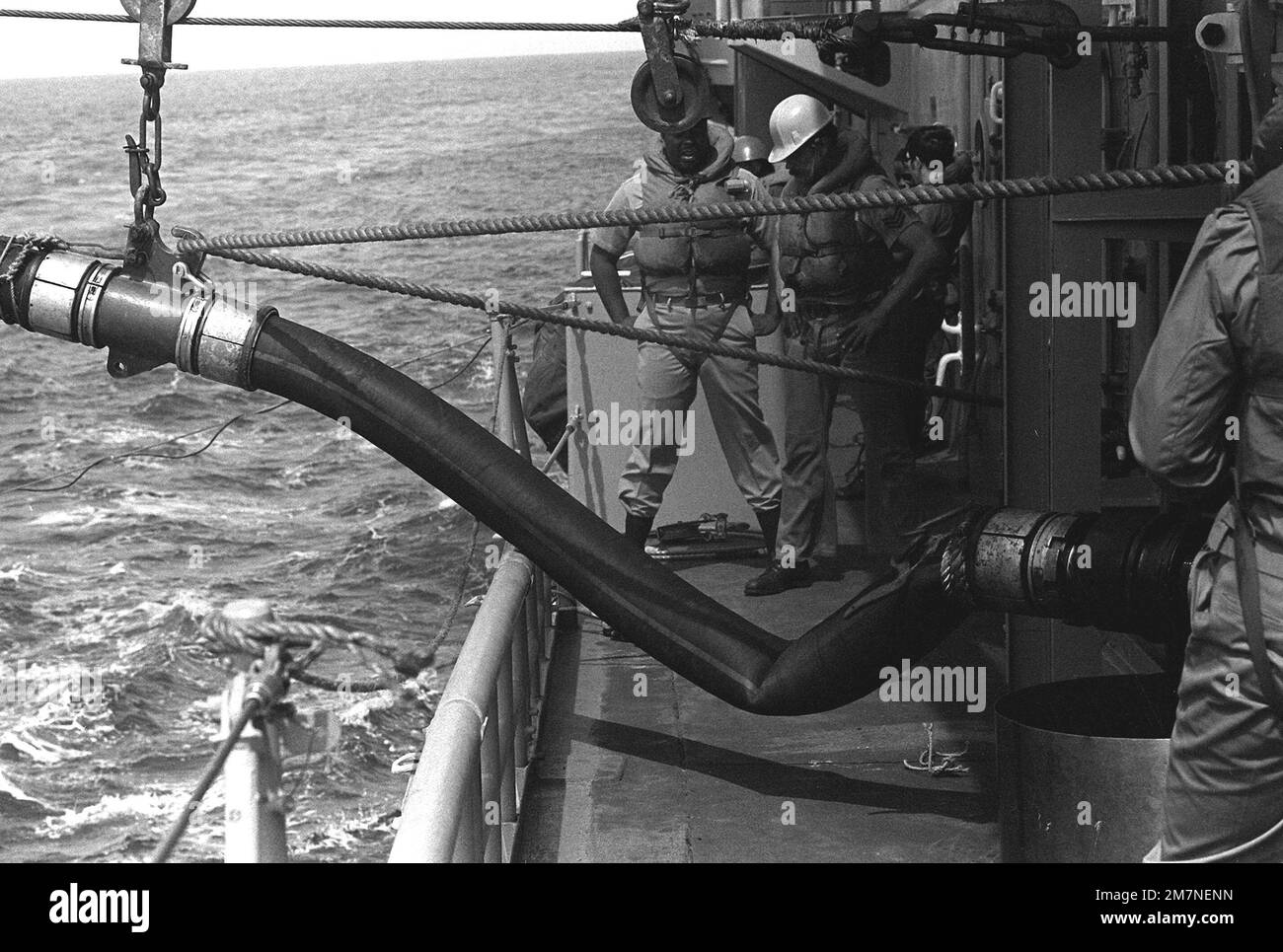 A hose connection on the guided missile destroyer USS DEWEY (DDG-45 ...