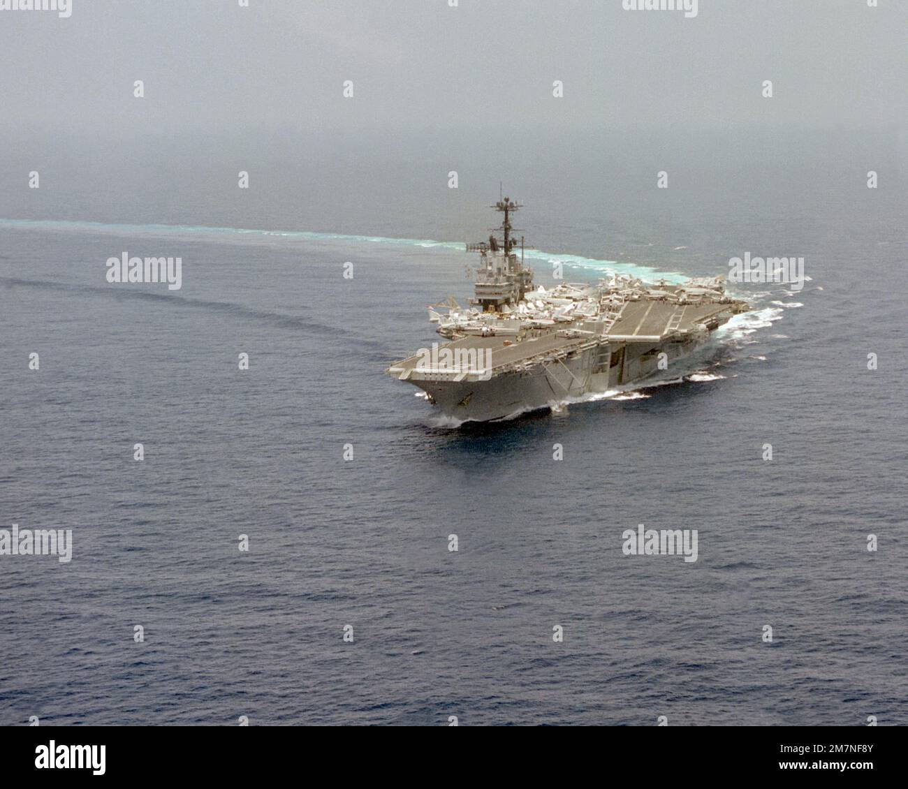 A high angle port bow view of the aircraft carrier USS INDEPENDENCE (CV ...