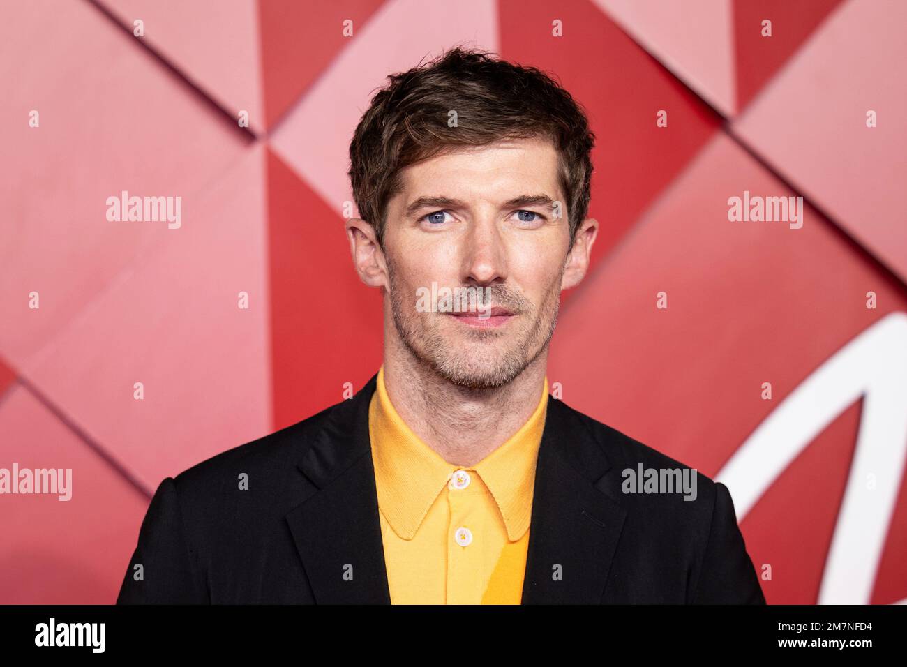 Gwilym Lee Poses For Photographers Upon Arrival At The British Fashion Awards In London Monday