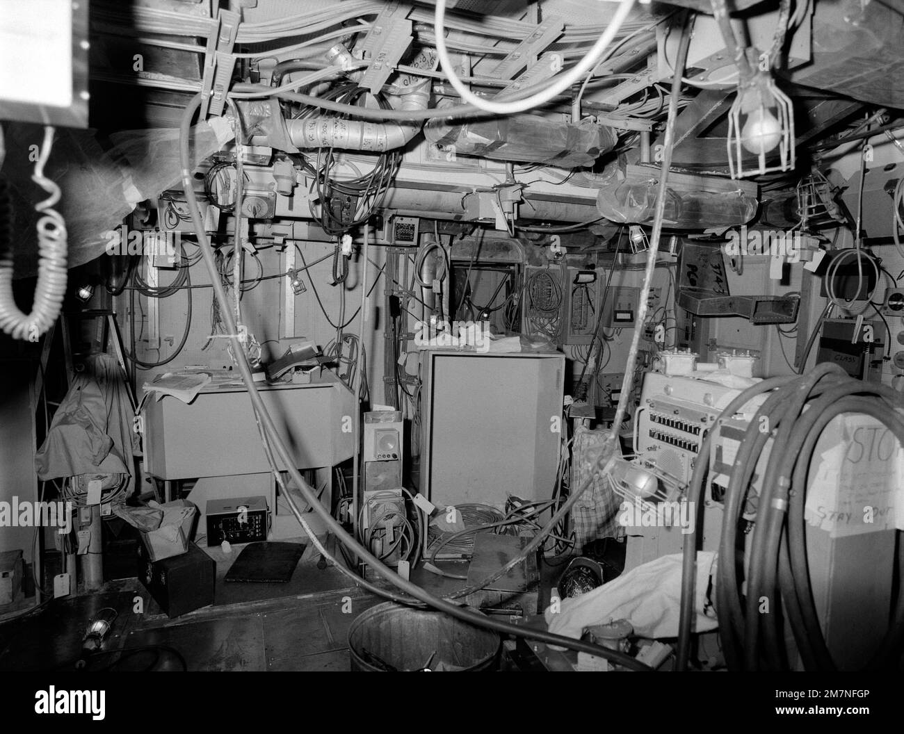 An interior view of the combat information center on the guided missile ...