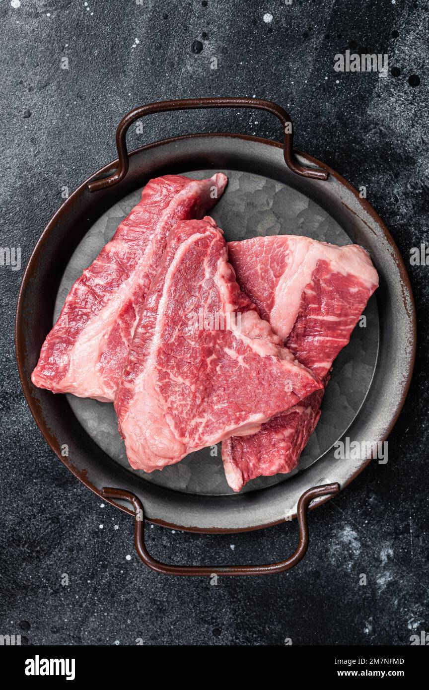 Raw Silverside sirloin beef steak cut on butcher tray. Black background ...