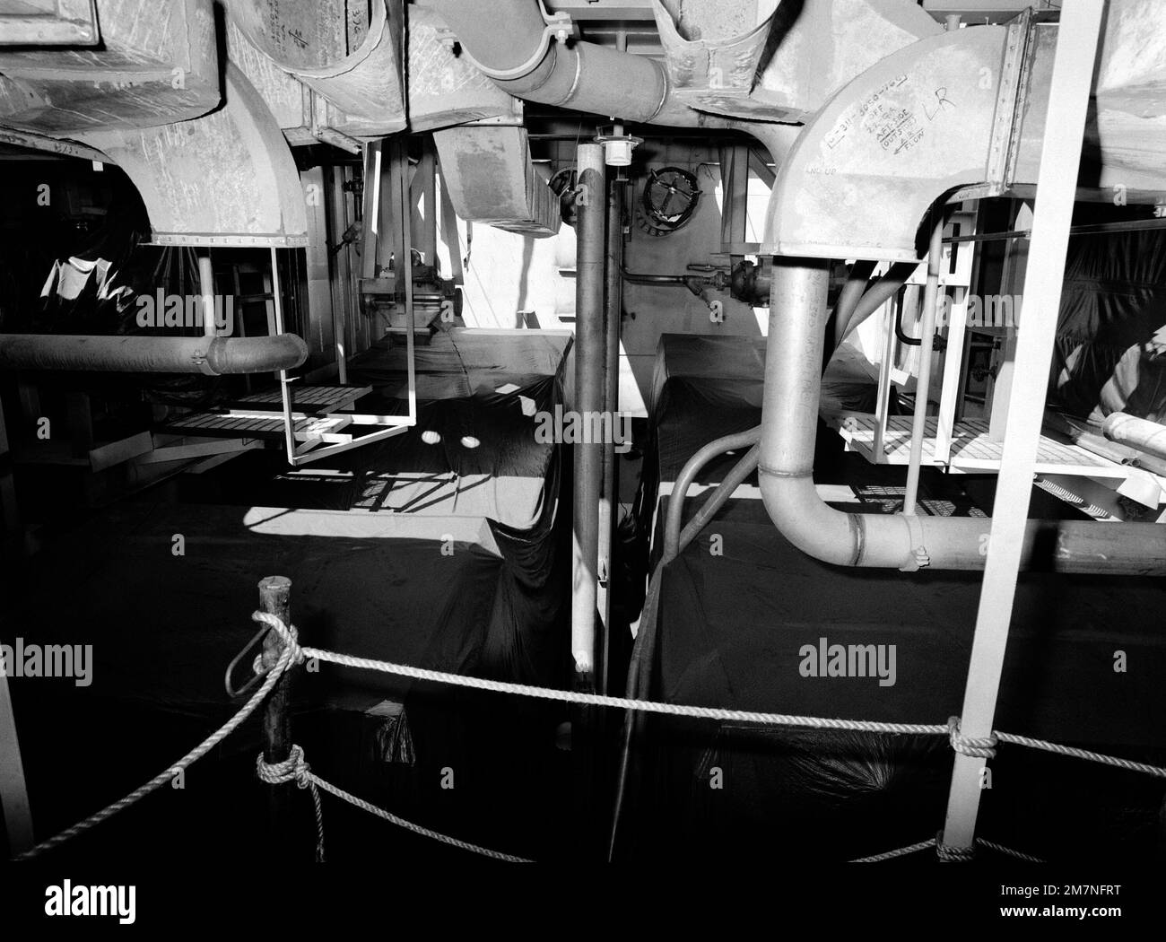 An interior view of the engine room on the guided missile frigate USS ...