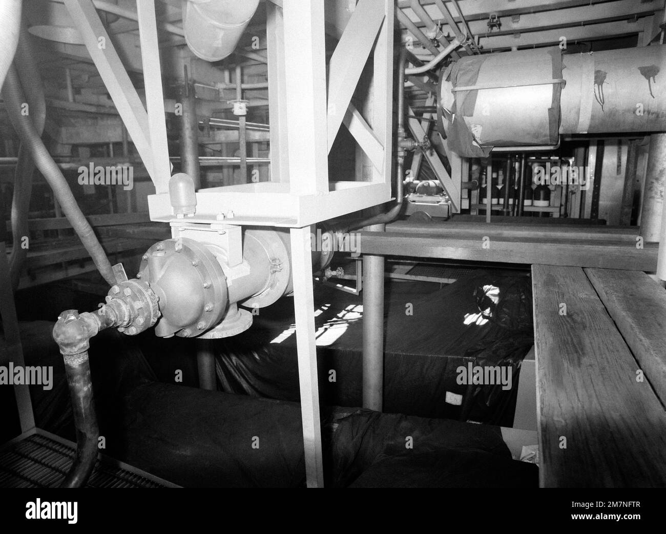 An interior view of the engine room on the guided missile frigate USS ...