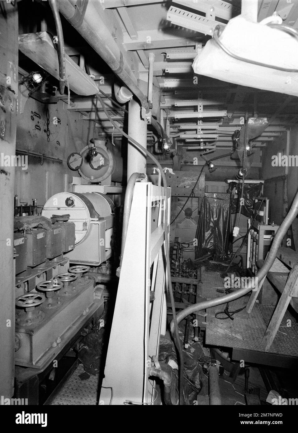An interior view of auxiliary machine room No. 3 on the guided missile ...