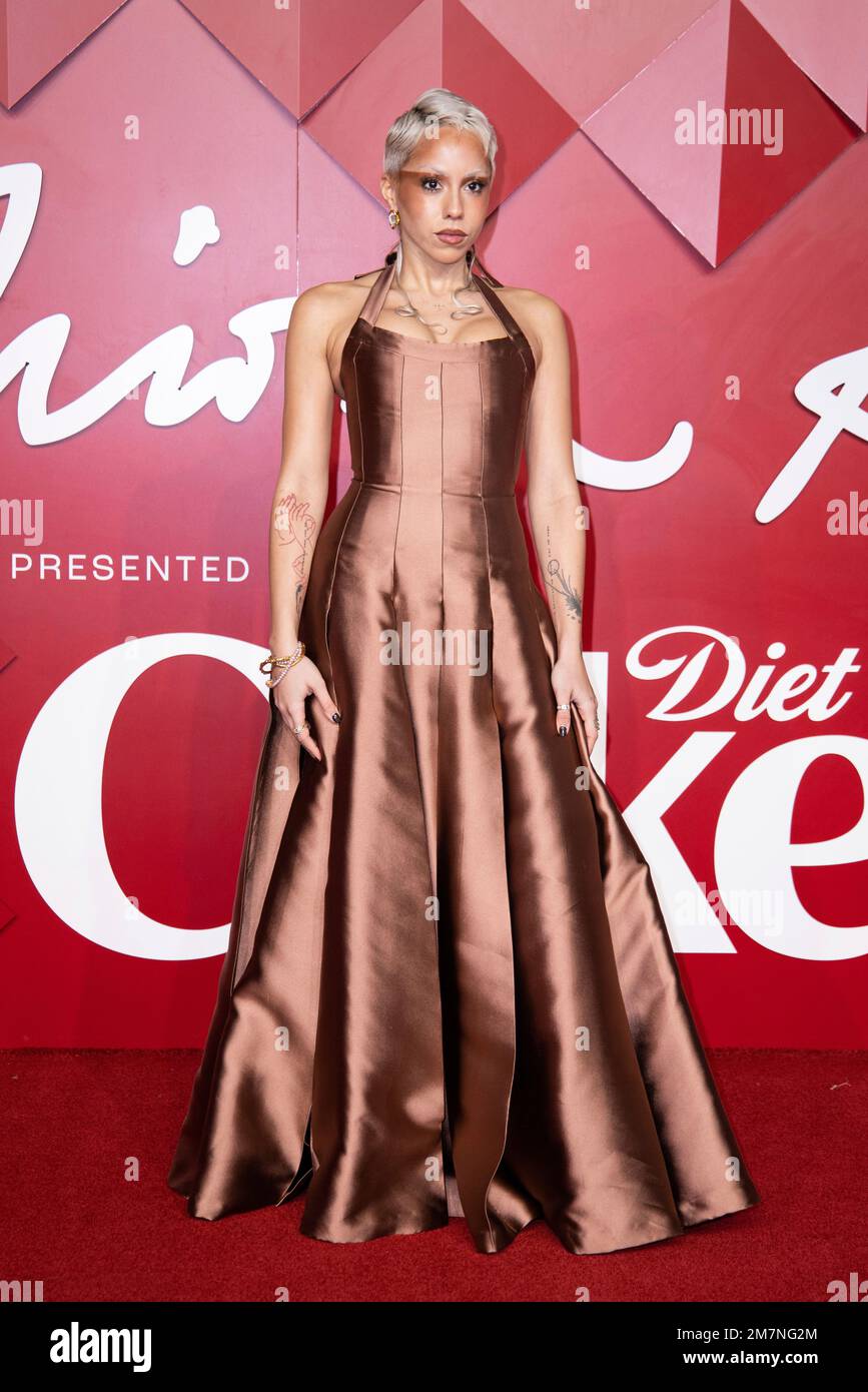 Poppy Ajudha poses for photographers upon arrival at the British ...