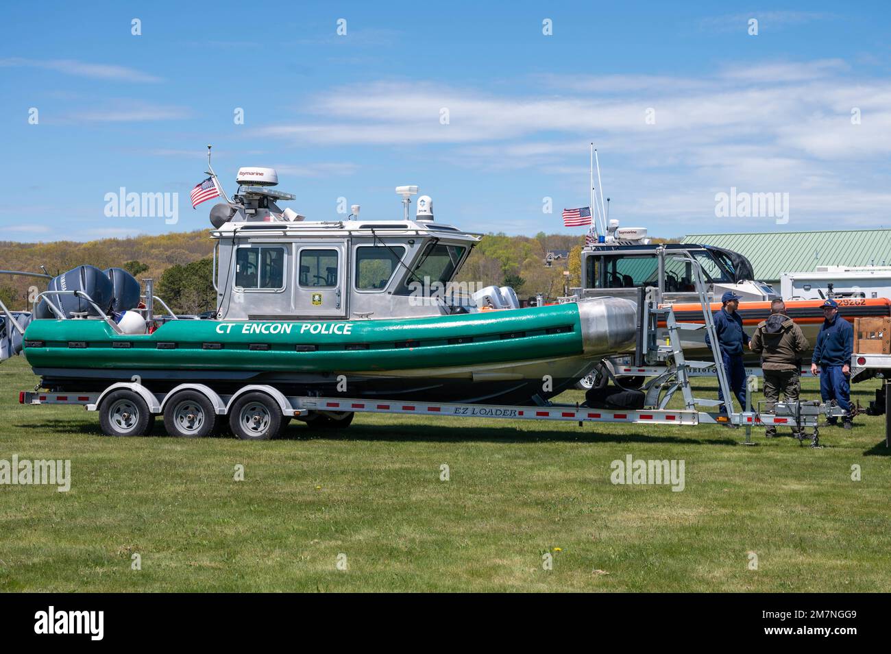 A Connecticut Environmental Conservation boat on display next to a U.S ...
