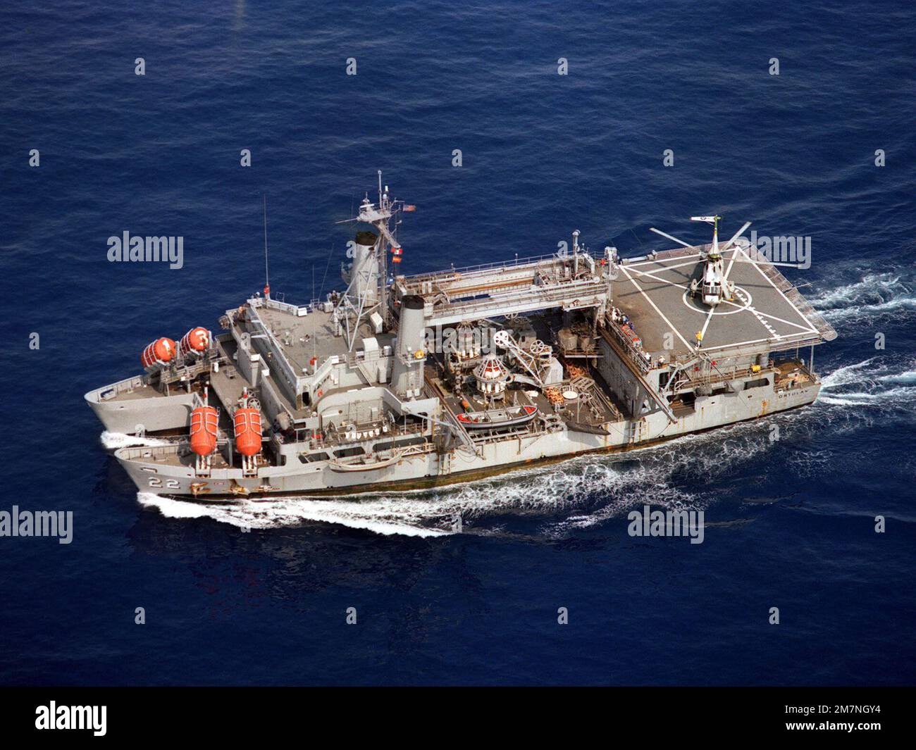An aerial port bow view of the submarine rescue ship USS ORTOLAN (ASR ...