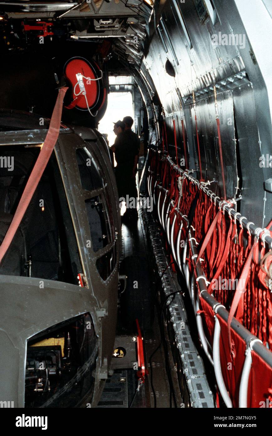 An interior view of a C-141 Starlifter aircraft showing side-to-side ...