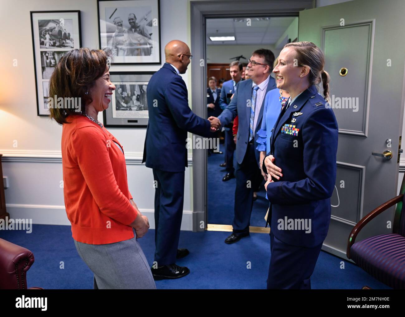 Air Force Capt. Taylor Bye speaks with Sharene Brown before a ceremony ...