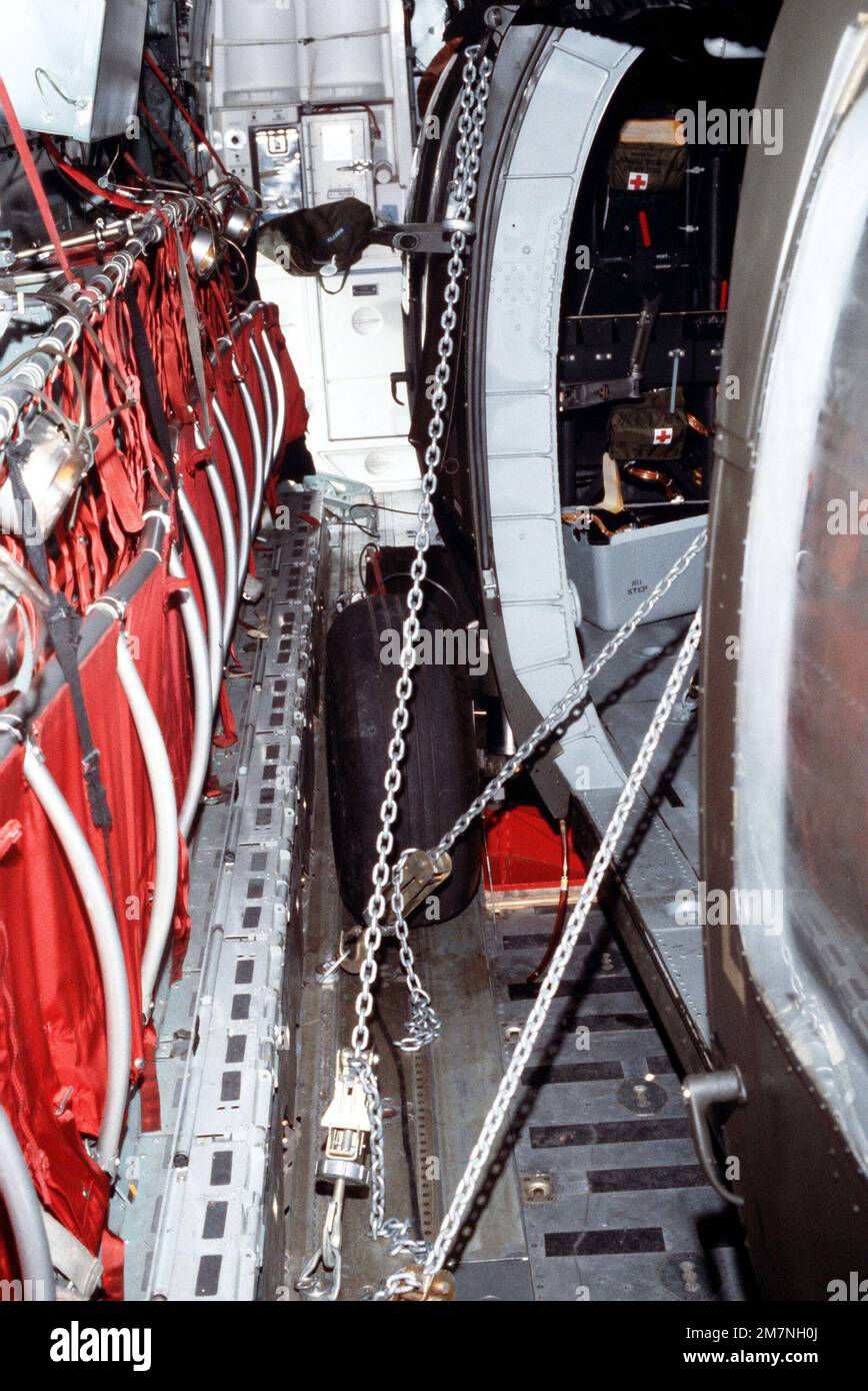 An interior view of a C-141 Starlifter aircraft showing side-to-side ...
