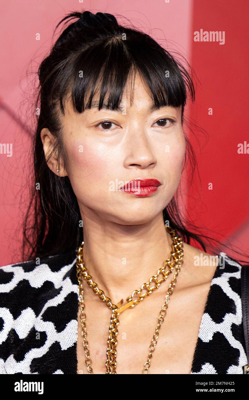 Mimi Xu poses for photographers upon arrival at the British Fashion ...