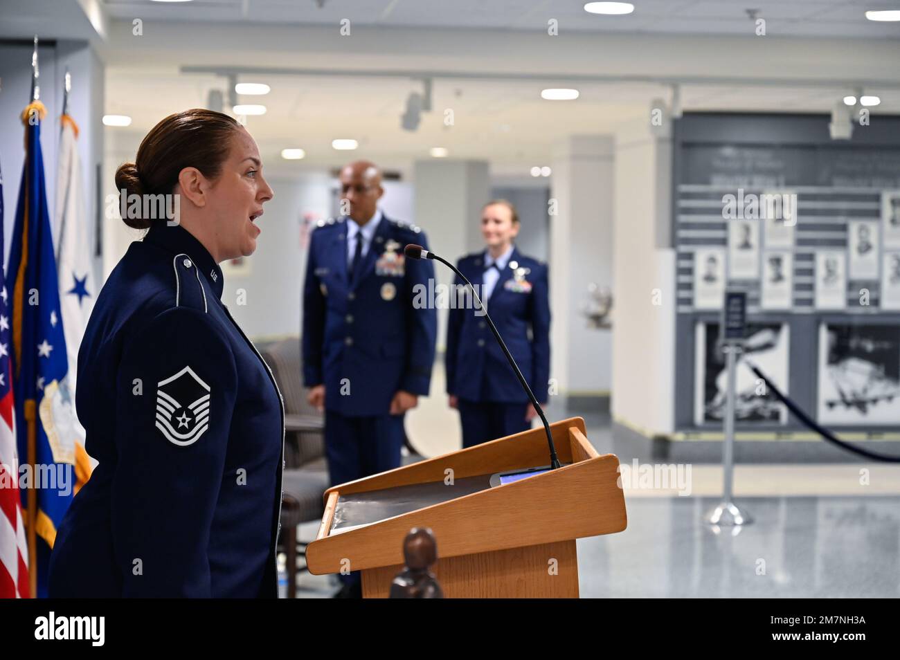 A member of the Air Force Band sings the national anthem during a ...