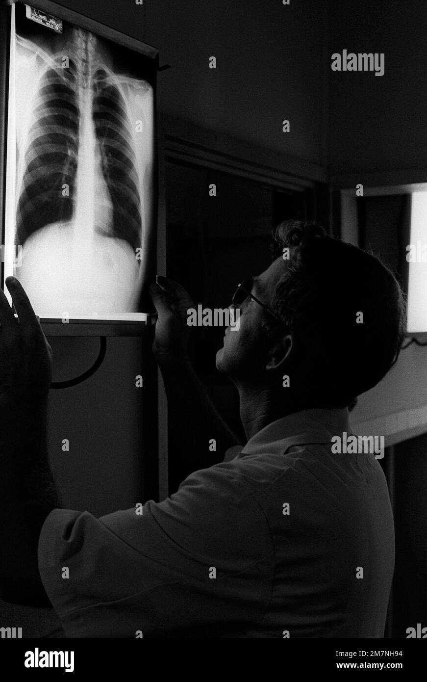 CPO Clay of the branch hospital checks over an X-ray as part of his job ...