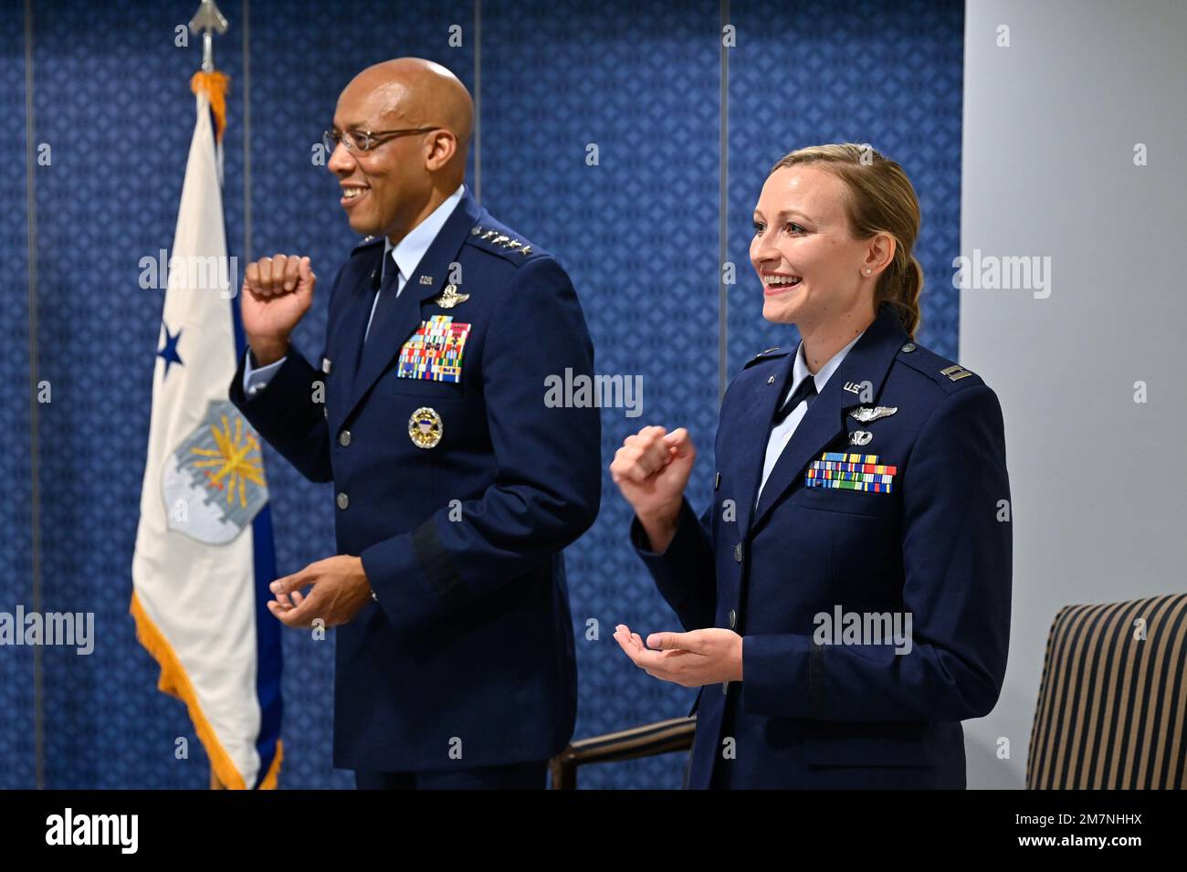 Capt. Taylor Bye and Air Force Chief of Staff Gen. CQ Brown, Jr. sing ...