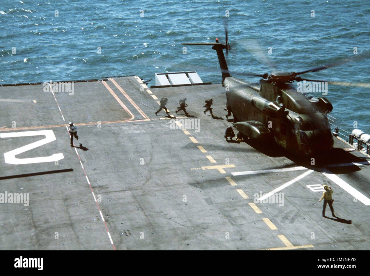 Marines cross the deck of the amphibious assault ship USS SAIPAN (LHA-2 ...