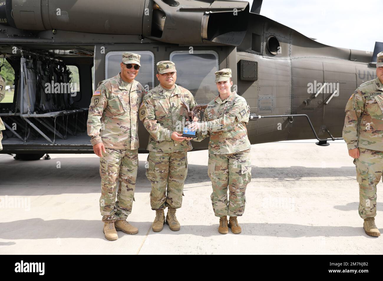 Gen. Michael X. Garrett presents Col. Jennifer Reynolds and Command Sgt ...