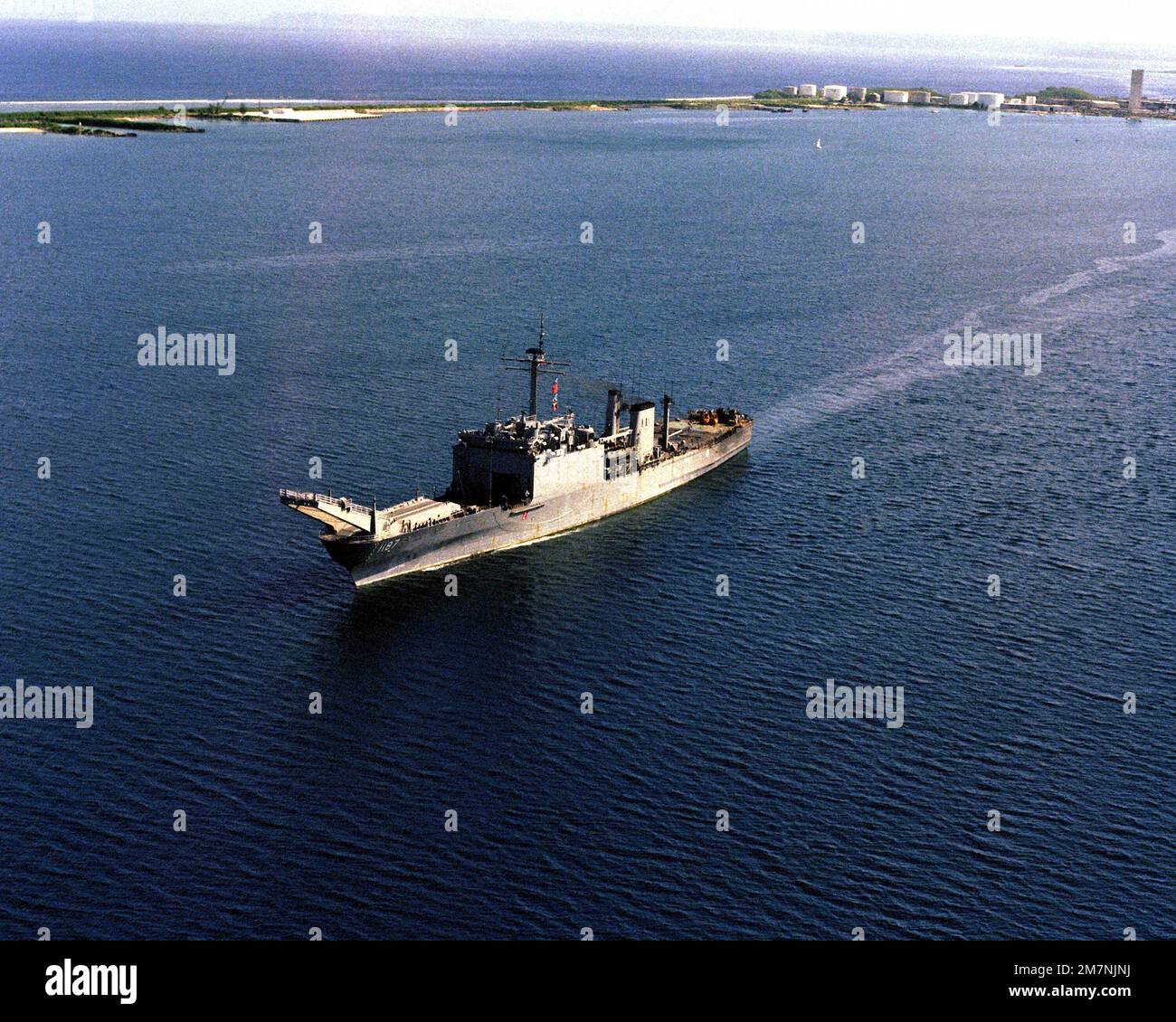 An aerial port bow view of the tank landing ship USS TUSCALOOSA (LST ...