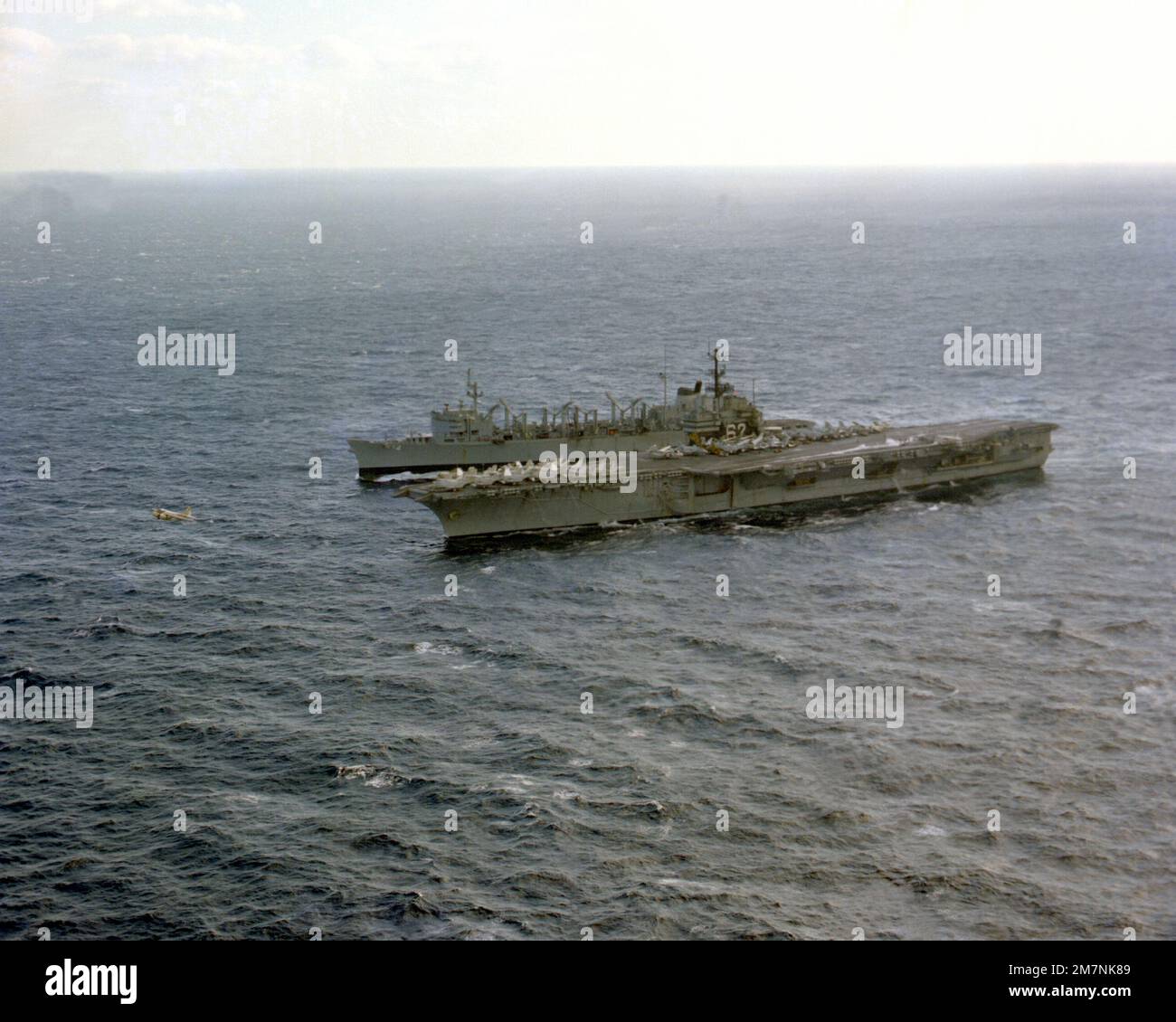 A port view of the aircraft carrier USS INDEPENDENCE (CV-62) with the ...