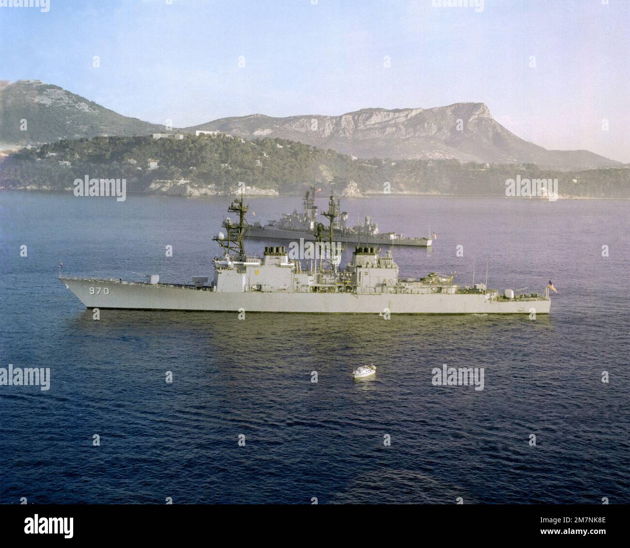 A port view of the destroyer USS CARON (DD-970) and the guided missile ...